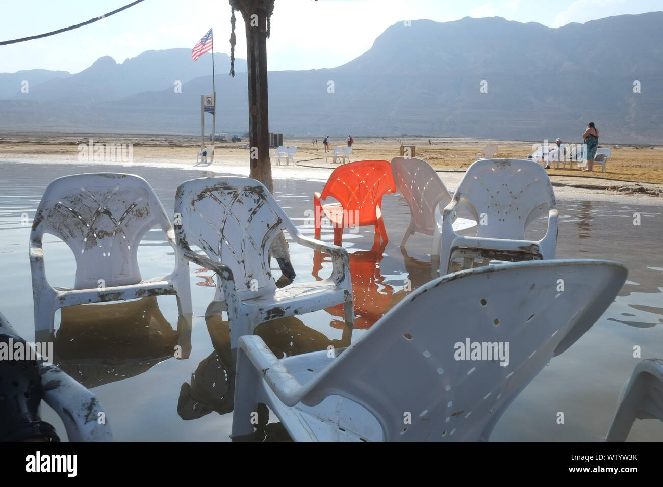 Israel, Ben Godi, Dead Sea, plastic chairs, beach Stock Photo - Alamy