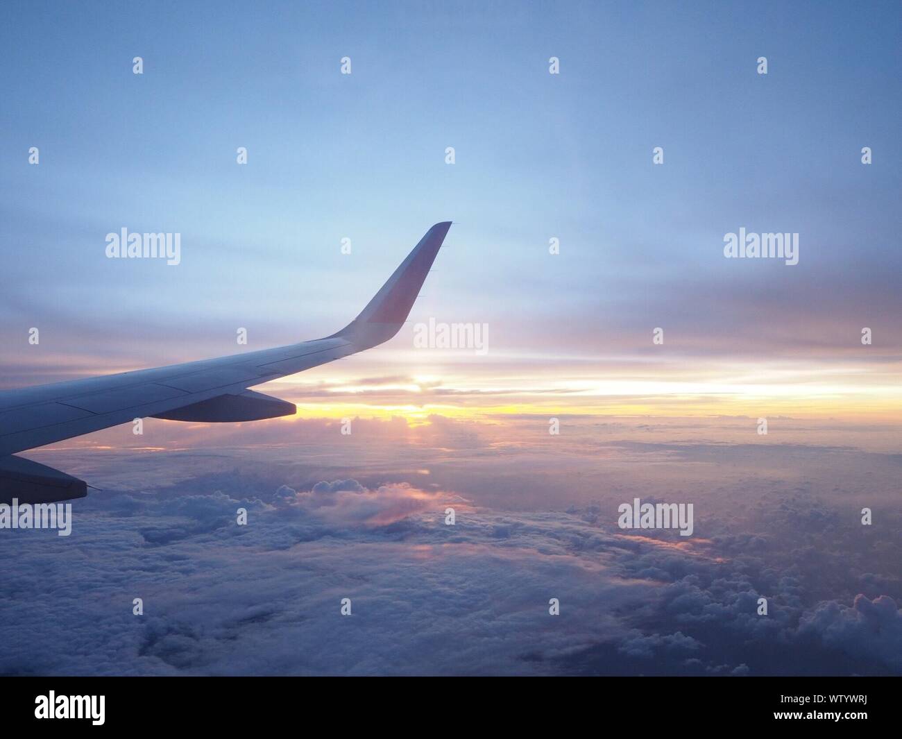 Clouds and sunset by an airplane hi-res stock photography and images ...