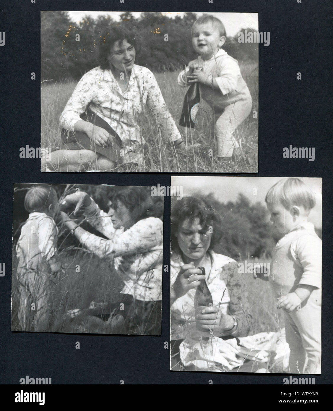 Poland, circa 1959: mother with her baby boy playing in the grass Stock ...