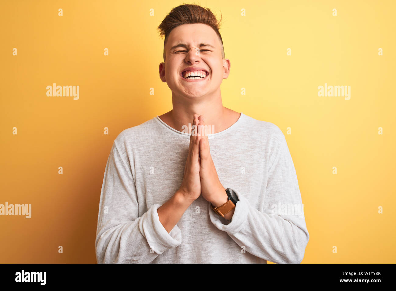 Young handsome man wearing white casual t-shirt standing over isolated ...