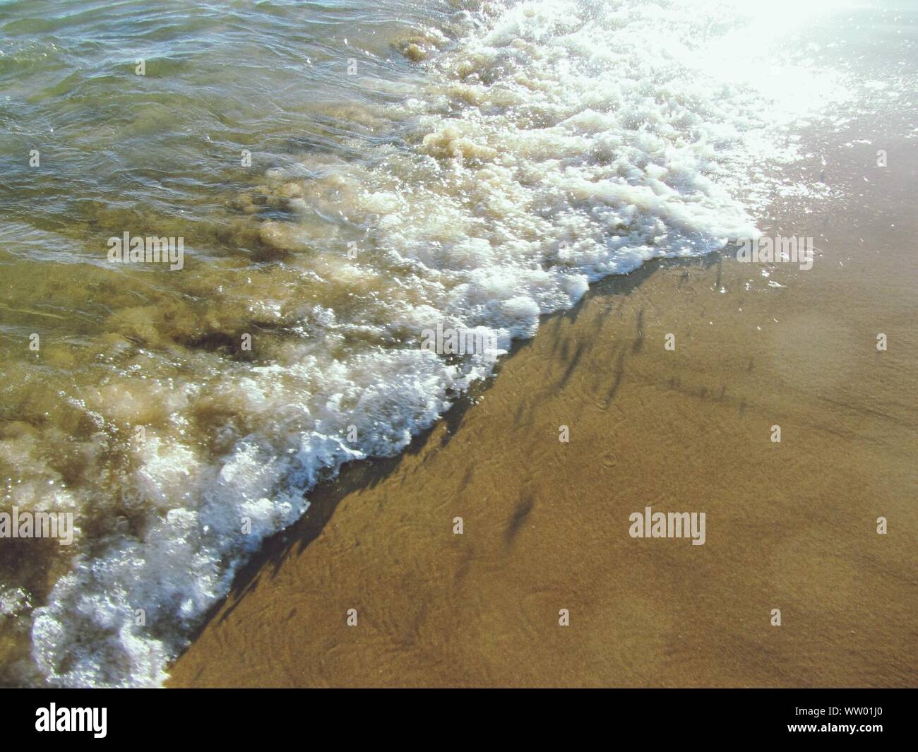 Water washing up on beach hi-res stock photography and images - Alamy