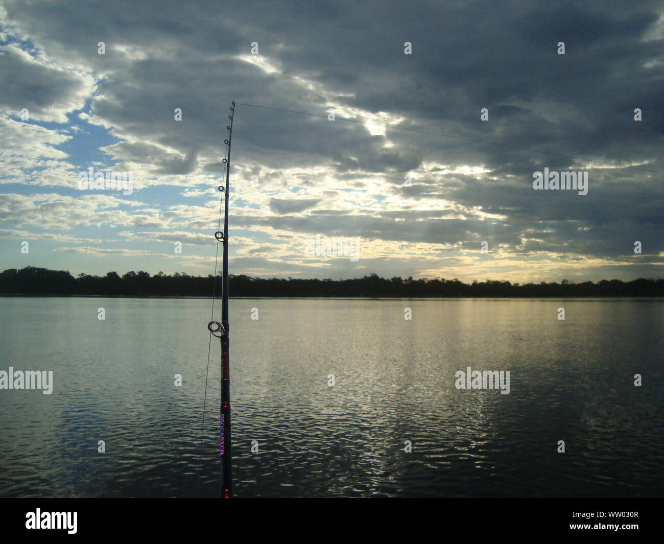 Fishing rod sunset hi-res stock photography and images - Alamy