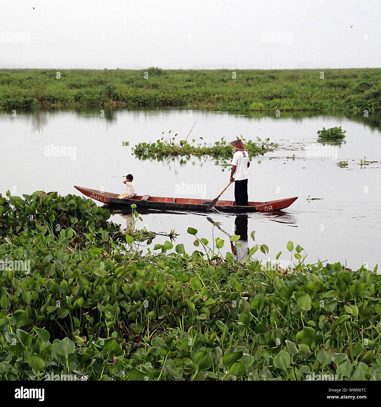 Two men paddling boat hi-res stock photography and images - Alamy