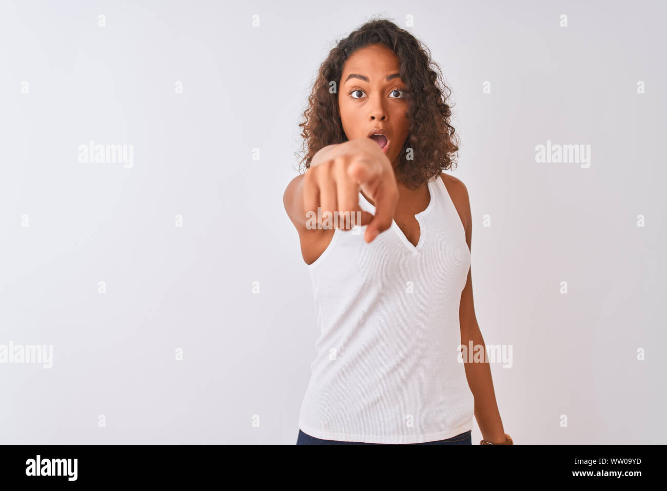 Young brazilian woman wearing casual t-shirt standing over isolated ...