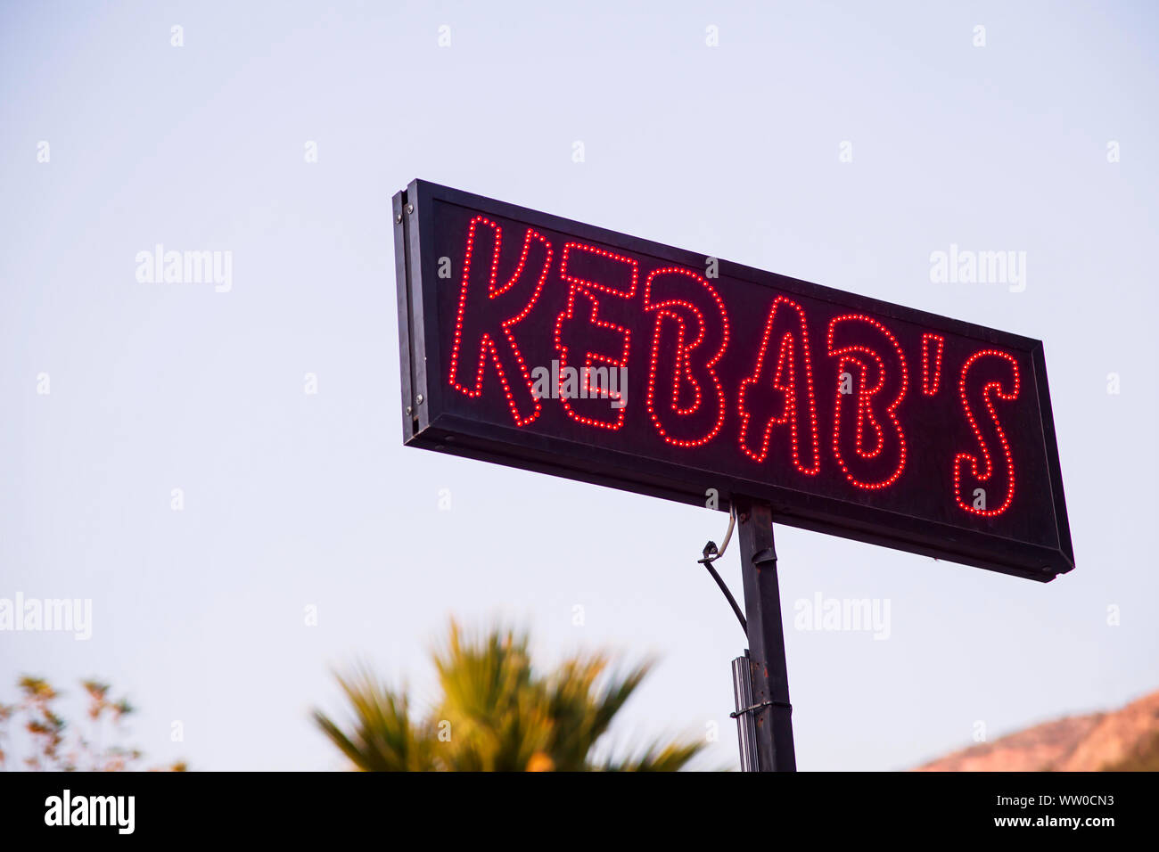 Bright red neon sign with Kebab inscription street food advertisement ...