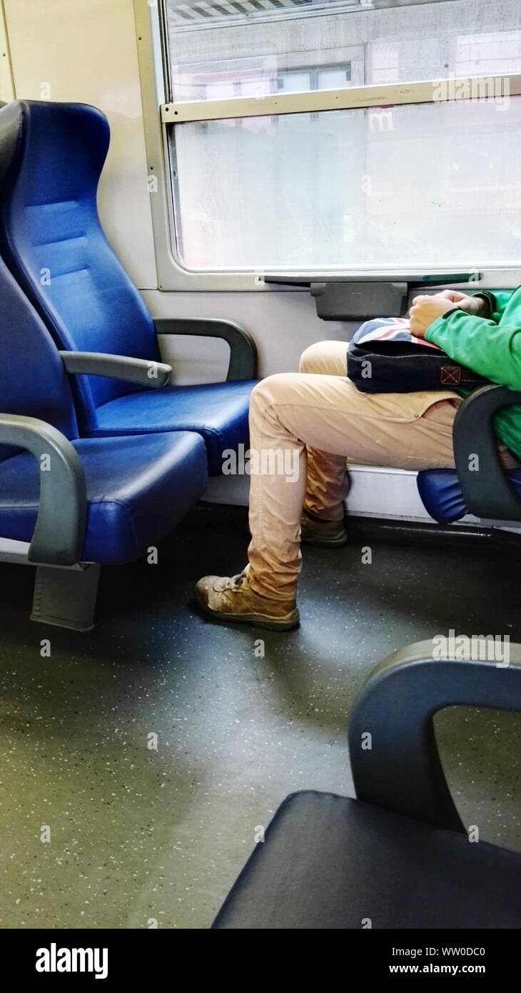 Man sitting on train hi-res stock photography and images - Alamy