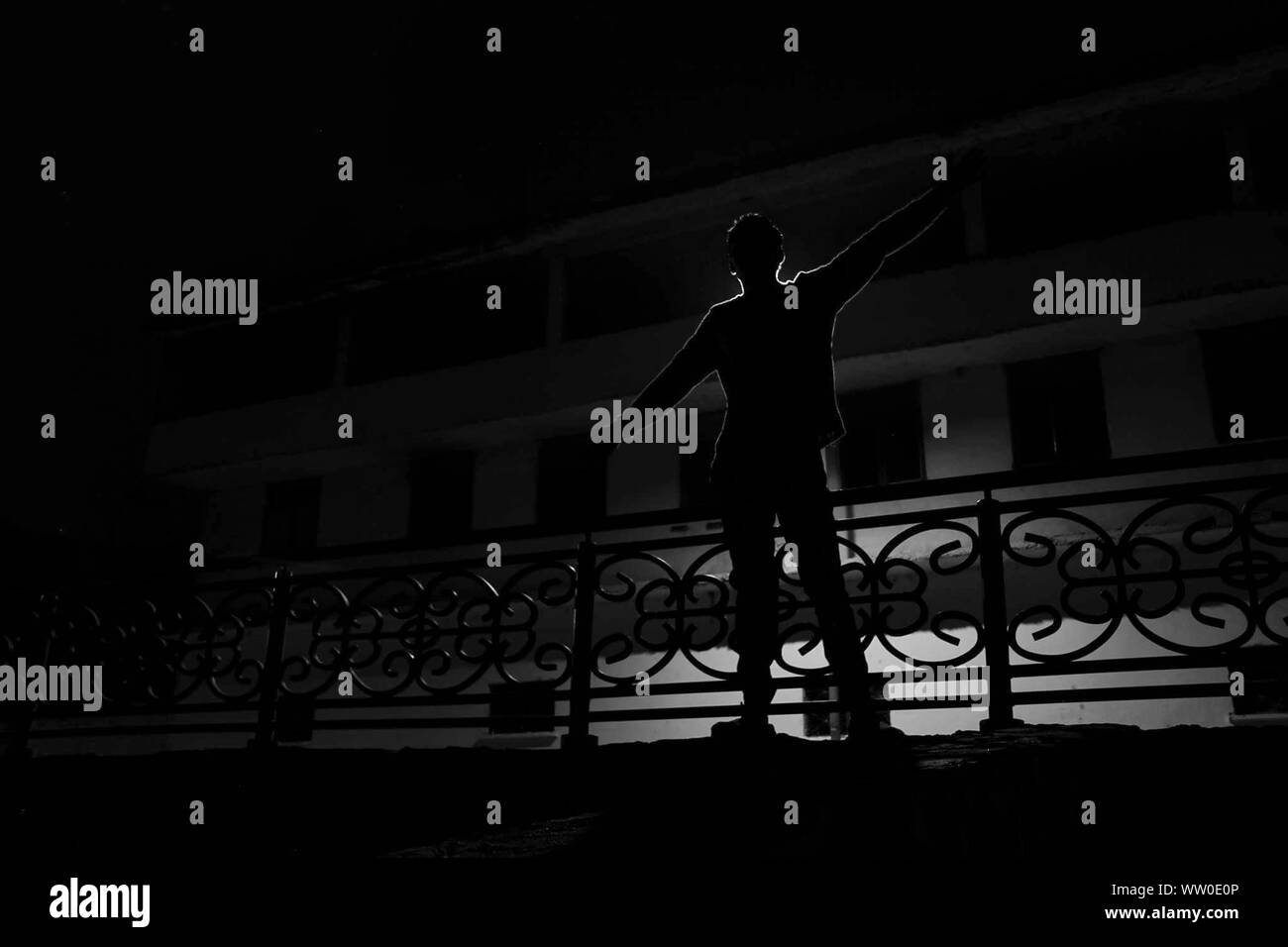 Low Angle View Of Silhouette Man Standing By Railing Stock Photo - Alamy