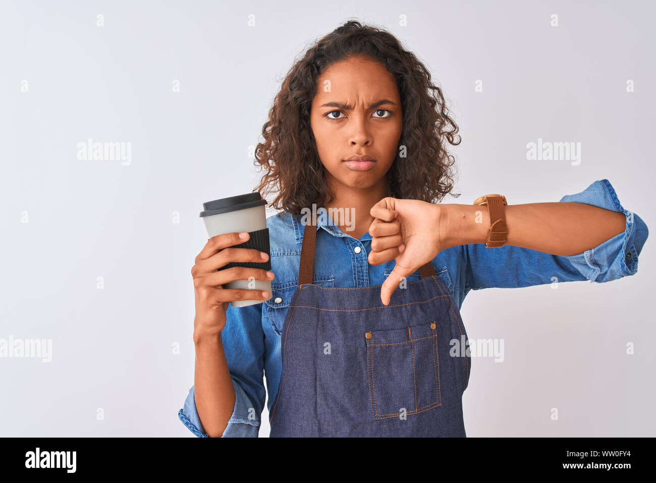 Young brazilian barista woman drinking take away coffee over isolated ...