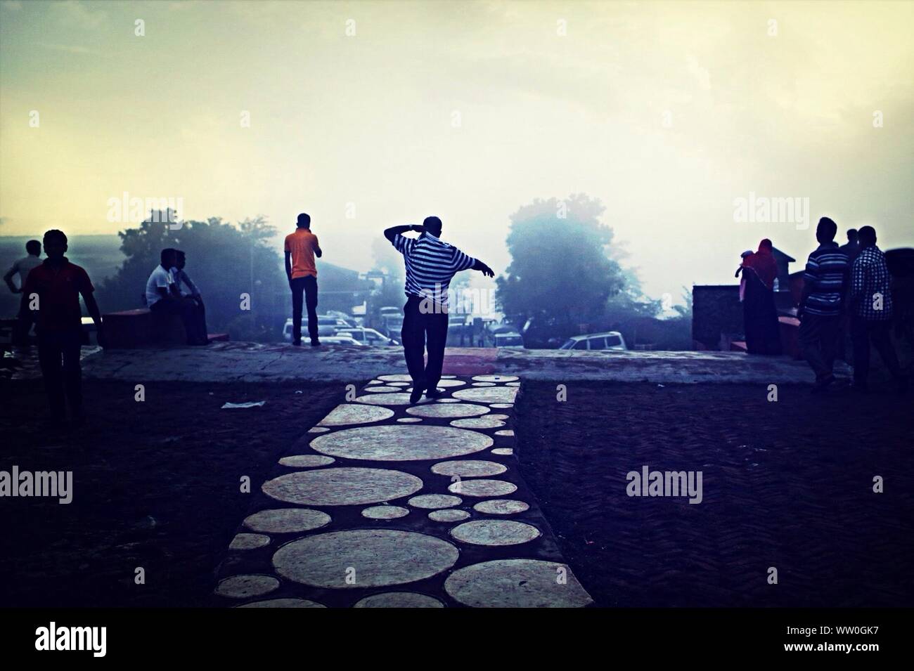 Man walking on pavement hi-res stock photography and images - Alamy