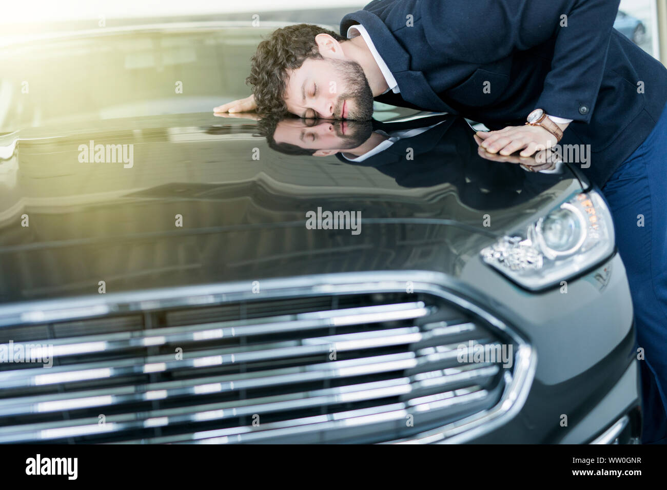 Happy man touching car in hi-res stock photography and images - Alamy
