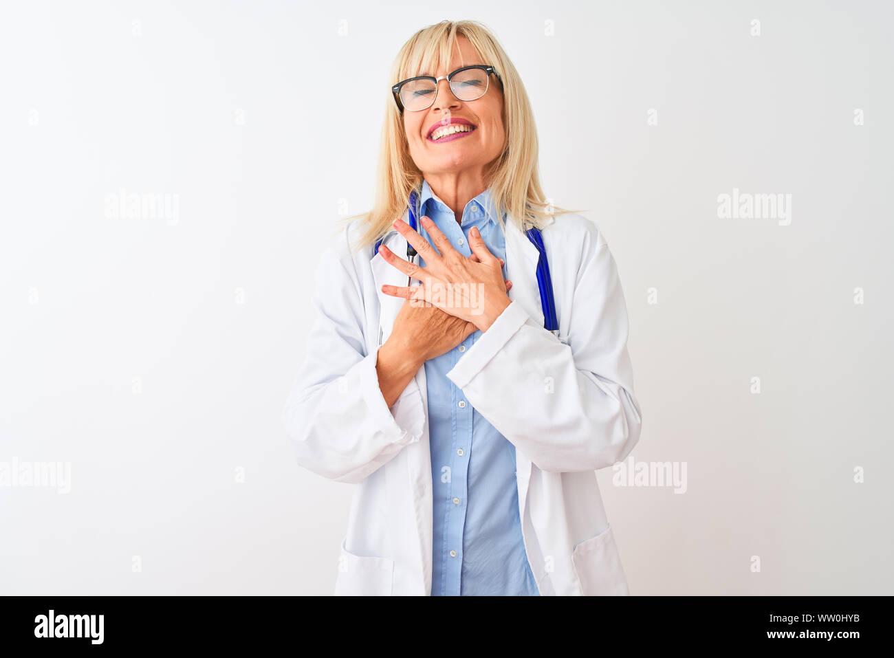 Middle age doctor woman wearing glasses and stethoscope over isolated ...