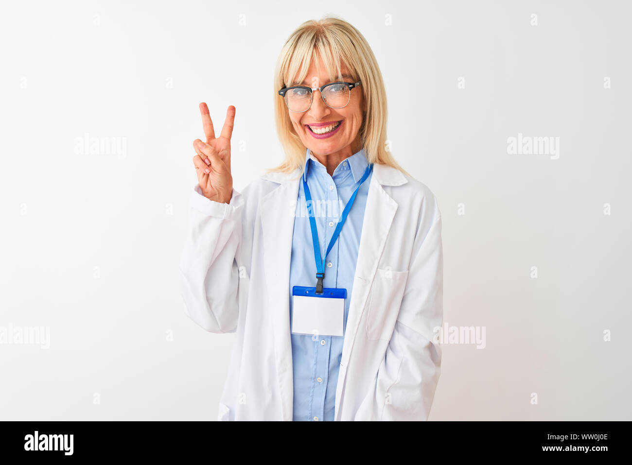 Middle age scientist woman wearing glasses and id card over isolated ...