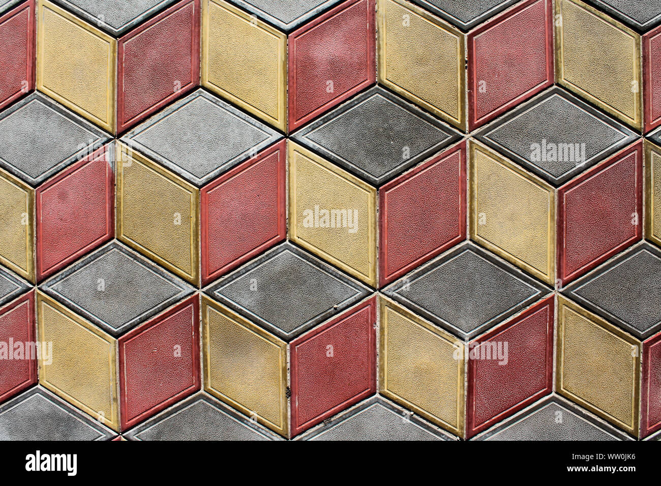 Colorful geometric tiles on the ground. Diamond shaped tiles of gray ...