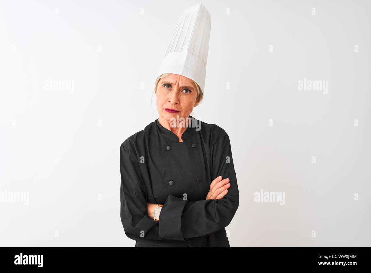 Middle age chef woman wearing uniform and hat standing over isolated ...