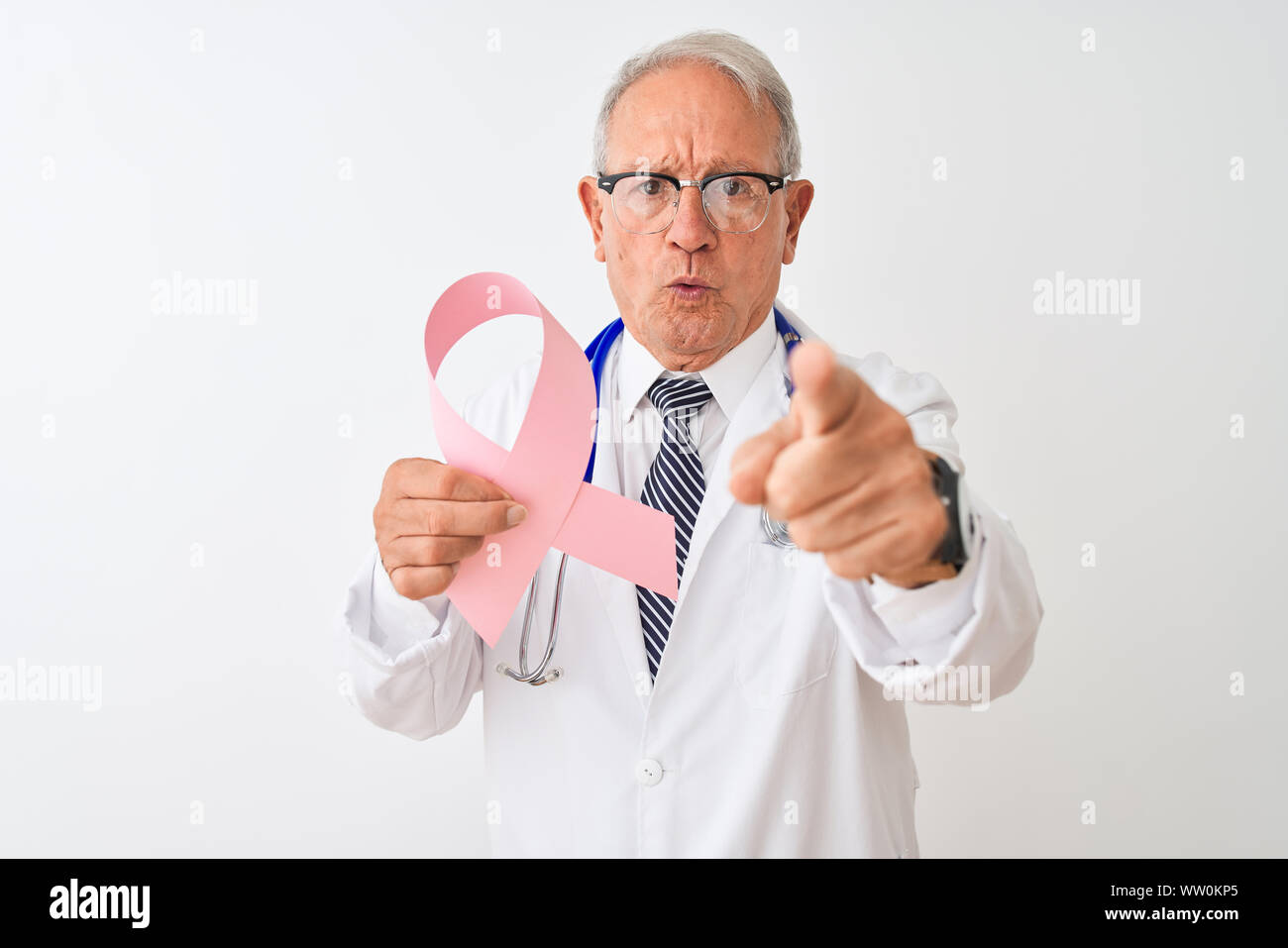 Senior grey-haired doctor man holding cancer ribbon over isolated white ...