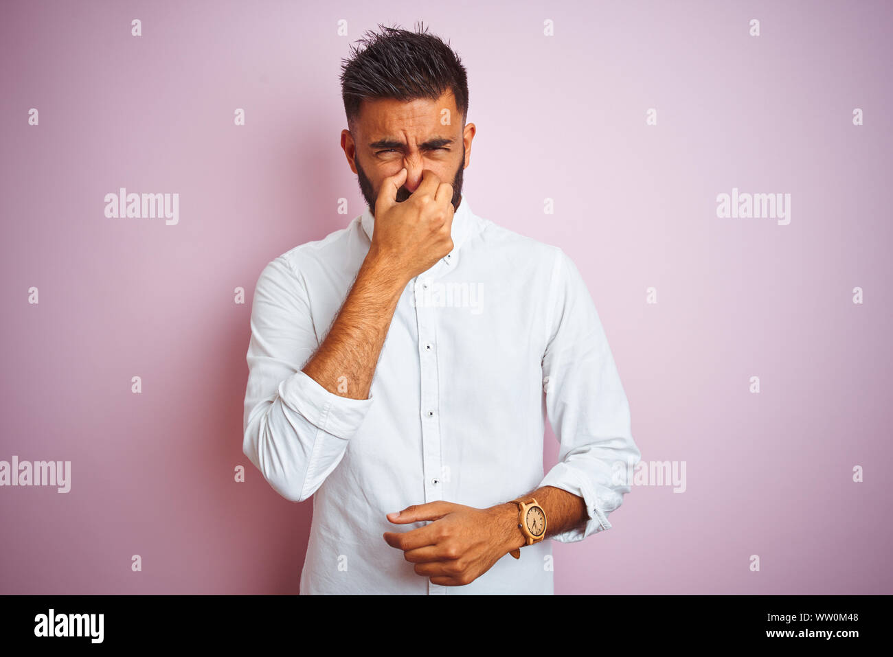 Young indian businessman wearing elegant shirt standing over isolated ...