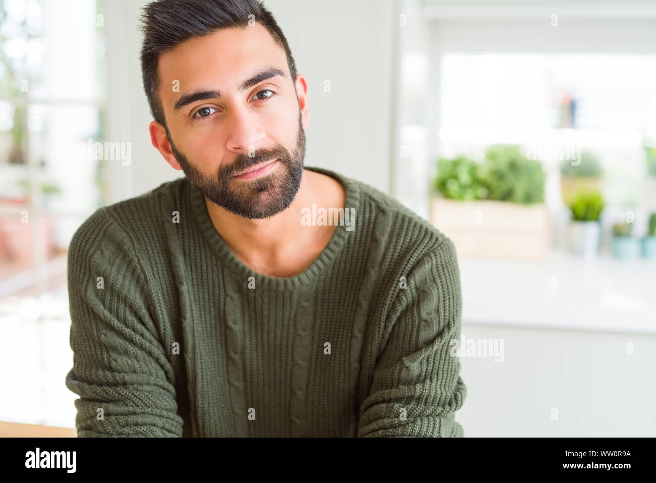 Handsome man looking relaxed and confident Stock Photo - Alamy