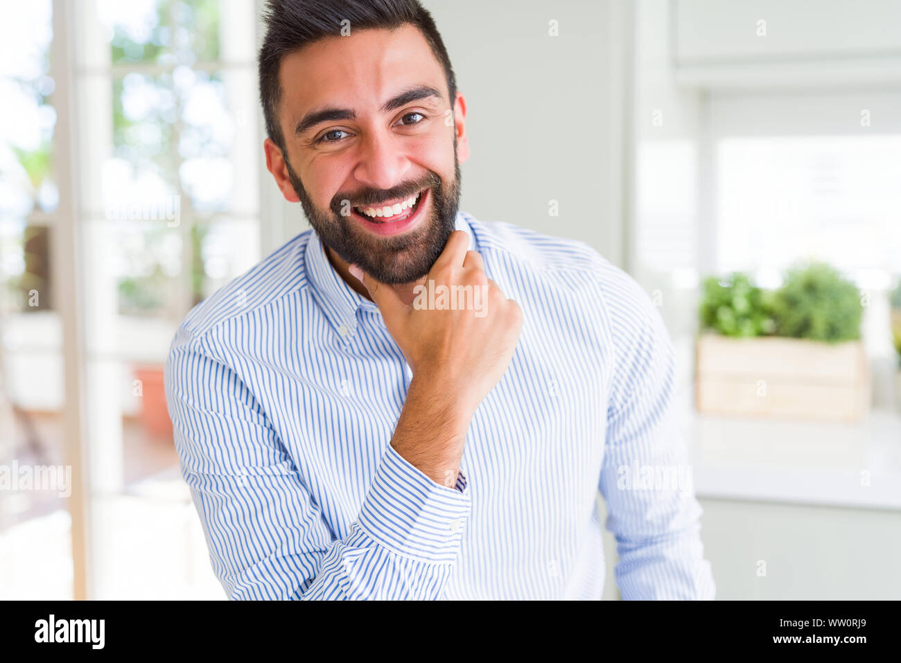 Handsome man smiling cheerful with a big smile on face showing teeth ...