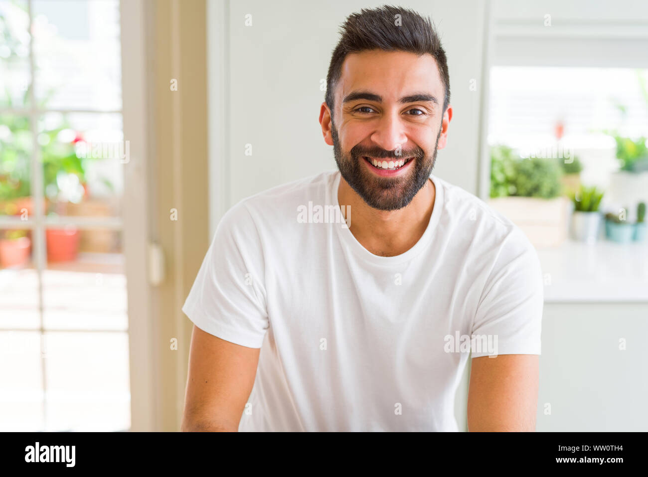 Handsome man smiling cheerful with a big smile on face showing teeth ...