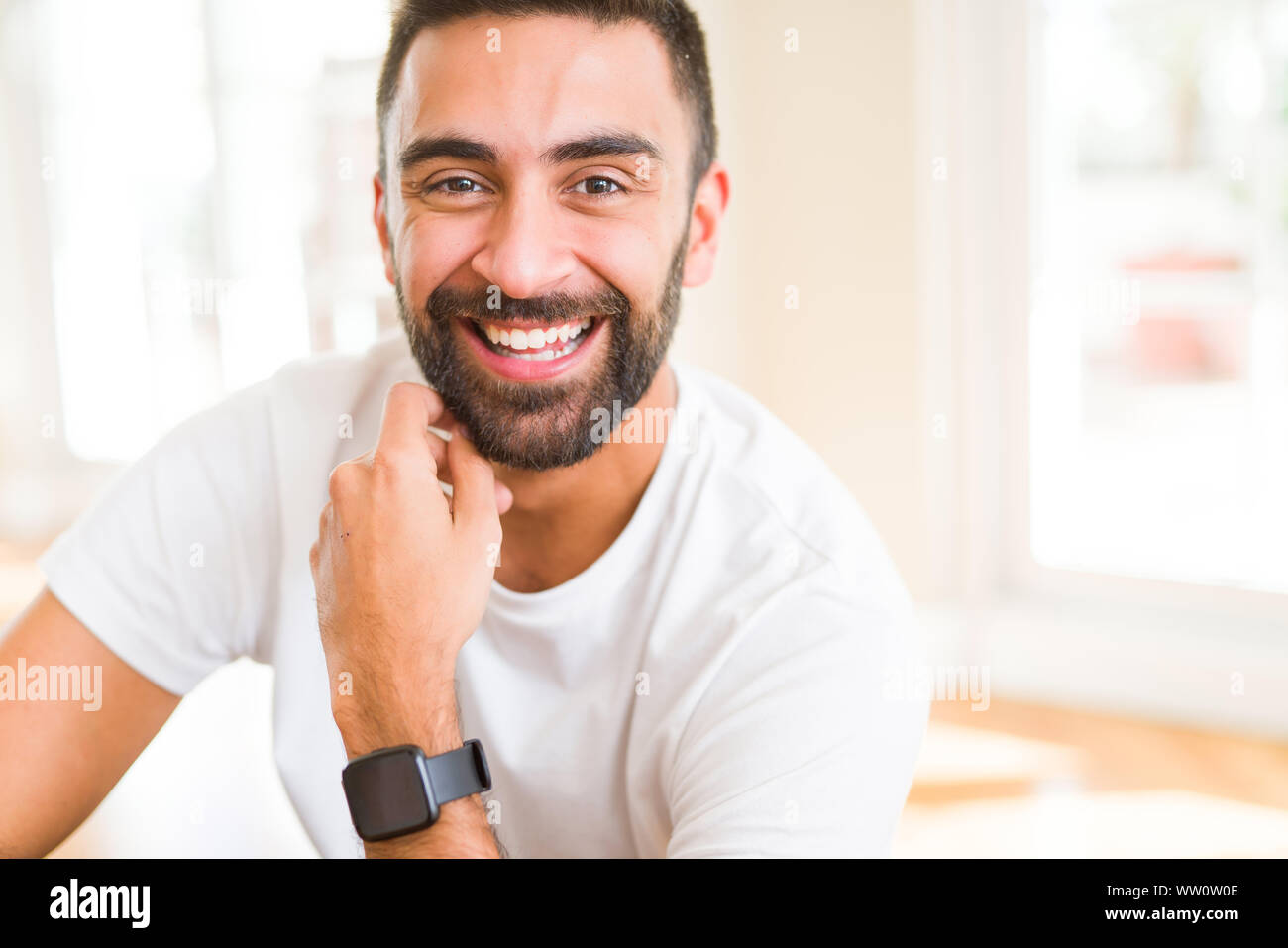 Handsome man smiling cheerful with a big smile on face showing teeth ...