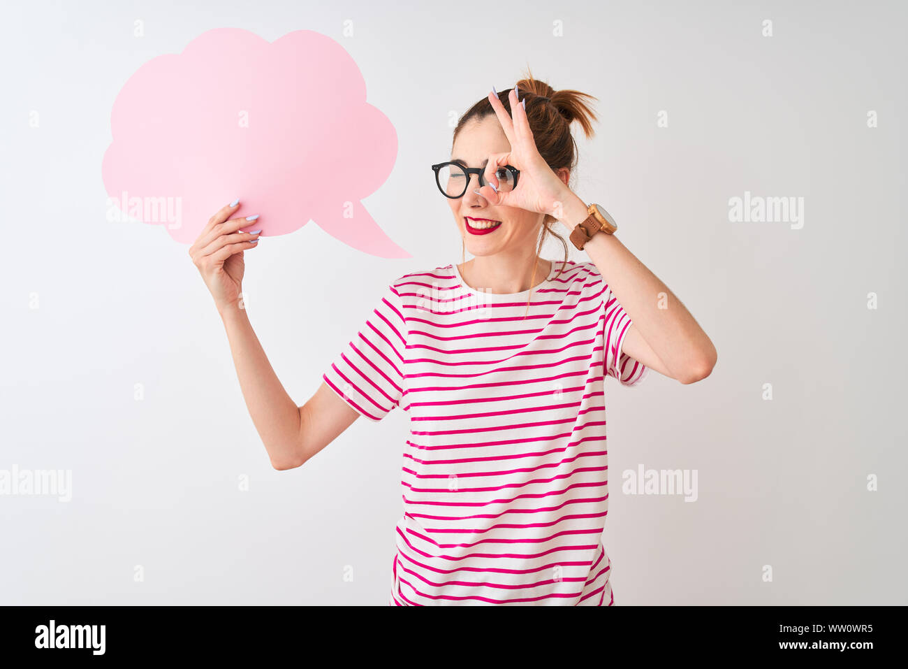 Redhead woman wearing glasses holding cloud speech bubble over isolated ...