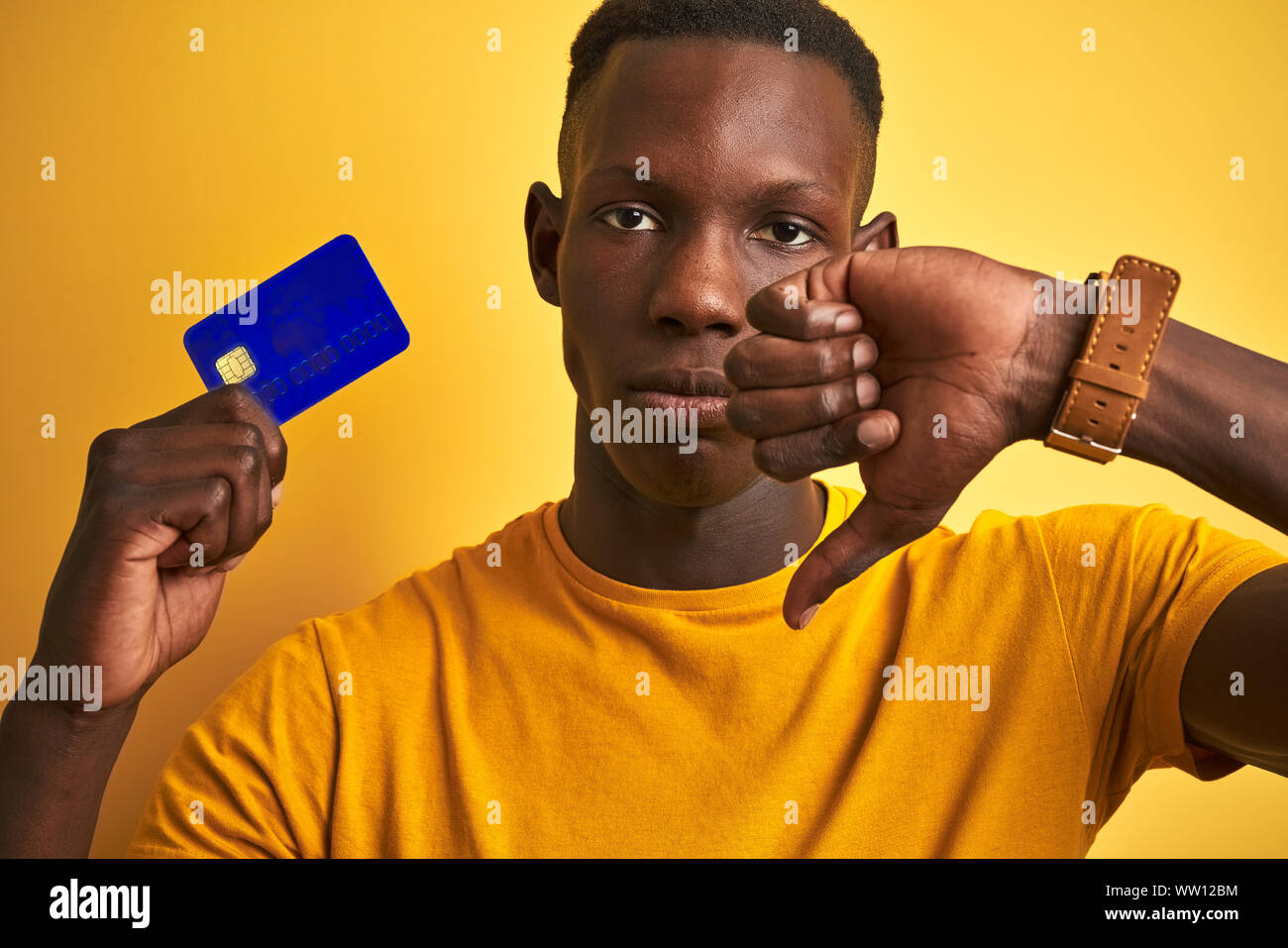 African american customer man holding credit card standing over ...