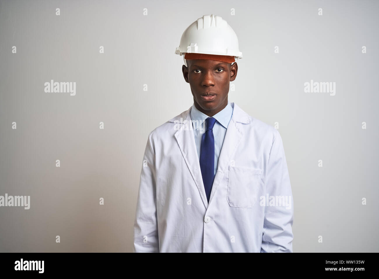 African american engineer man wearing coat and helmet over isolated ...