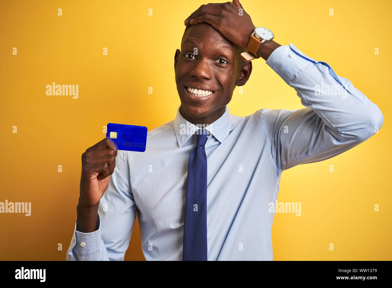 African american businessman holding credit card standing over isolated ...