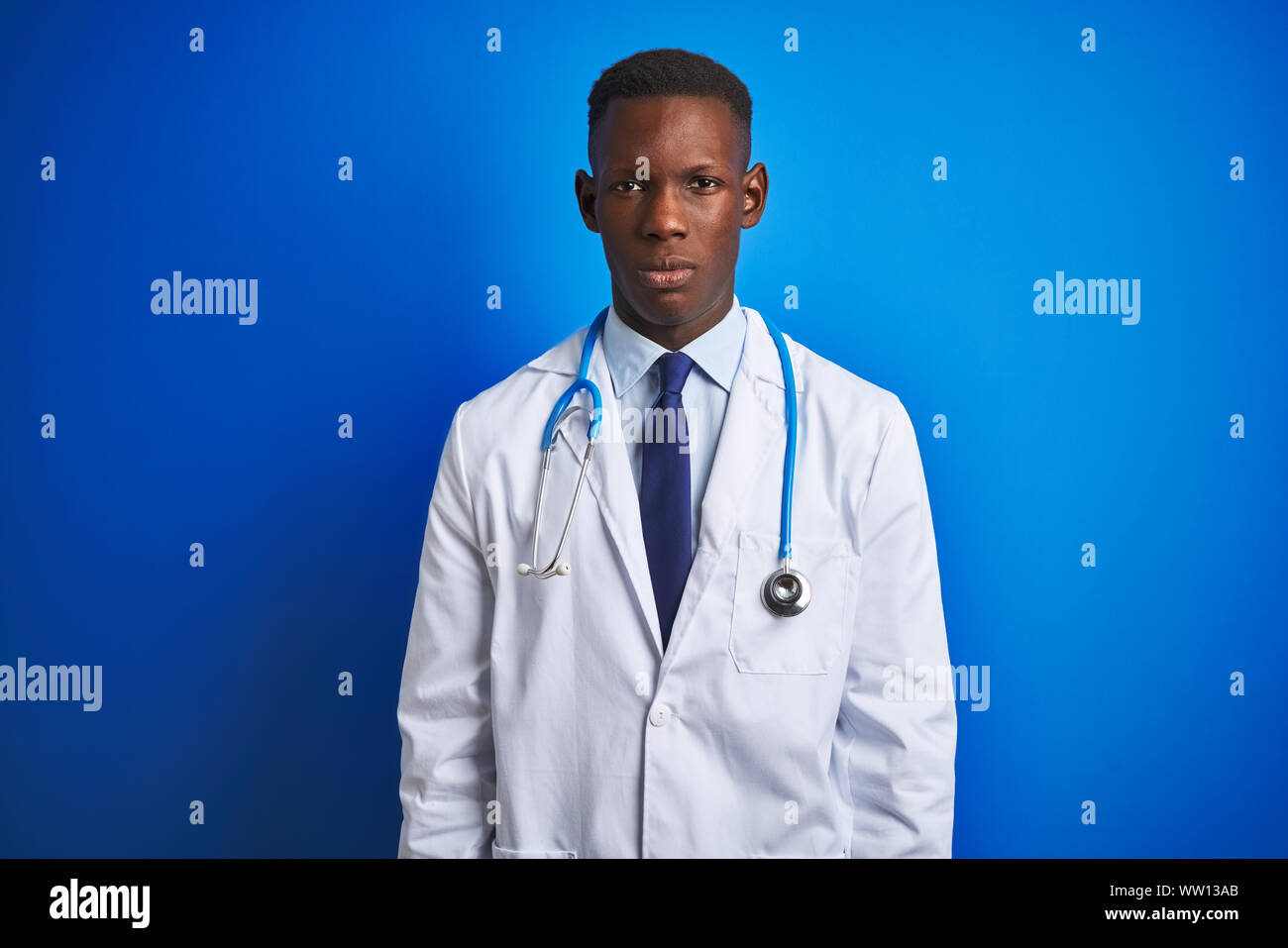 African american doctor man wearing stethoscope standing over isolated ...