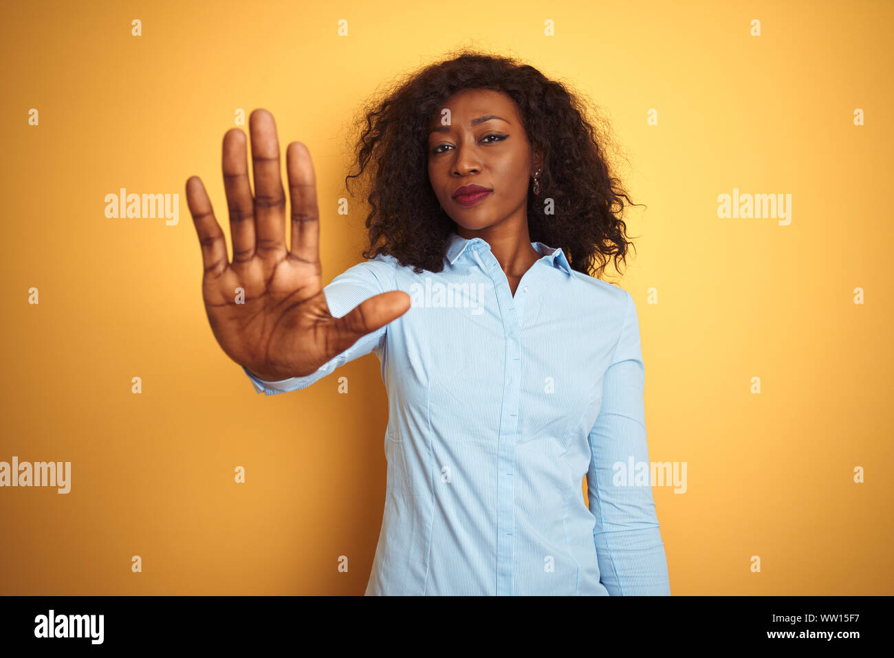 African american businesswoman wearing elegant shirt over isolated ...