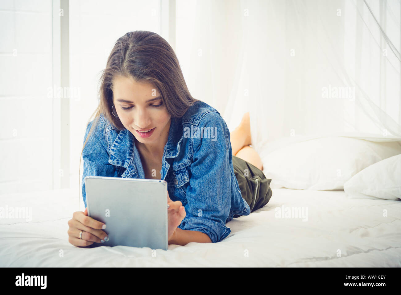 Beautiful girl surfing the internet with iPad in a relaxing time Stock ...