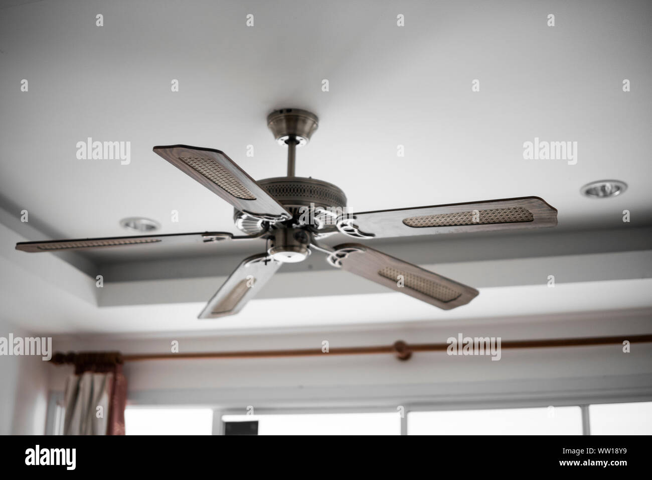 Picture of wooden ceiling fan inside the living room Stock Photo - Alamy