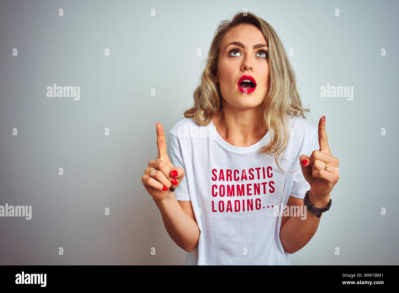 Beautiful woman wearing sacarstic comments loading t-shirt over ...