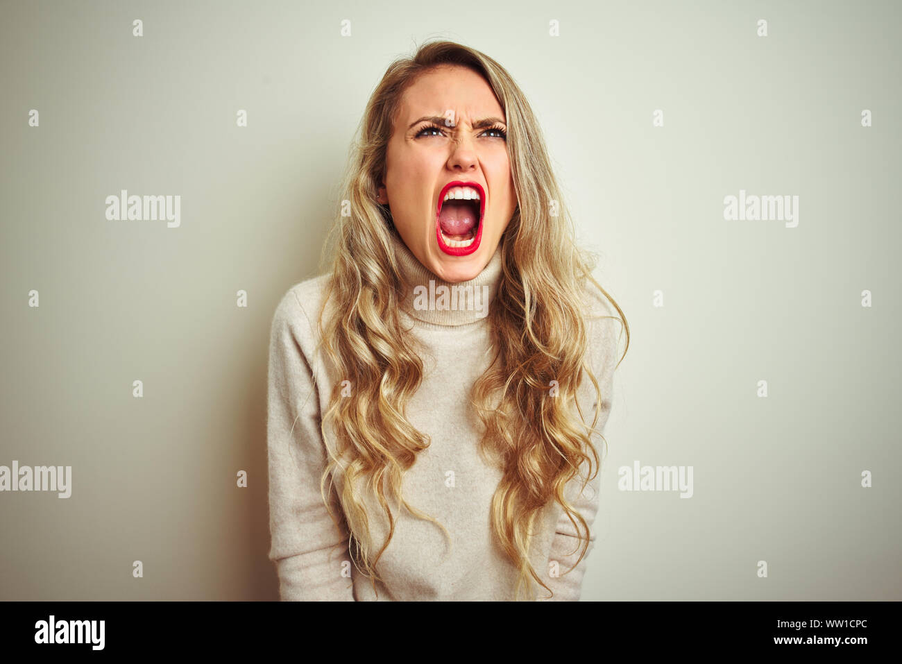 Beautiful woman wearing winter turtleneck sweater over isolated white ...