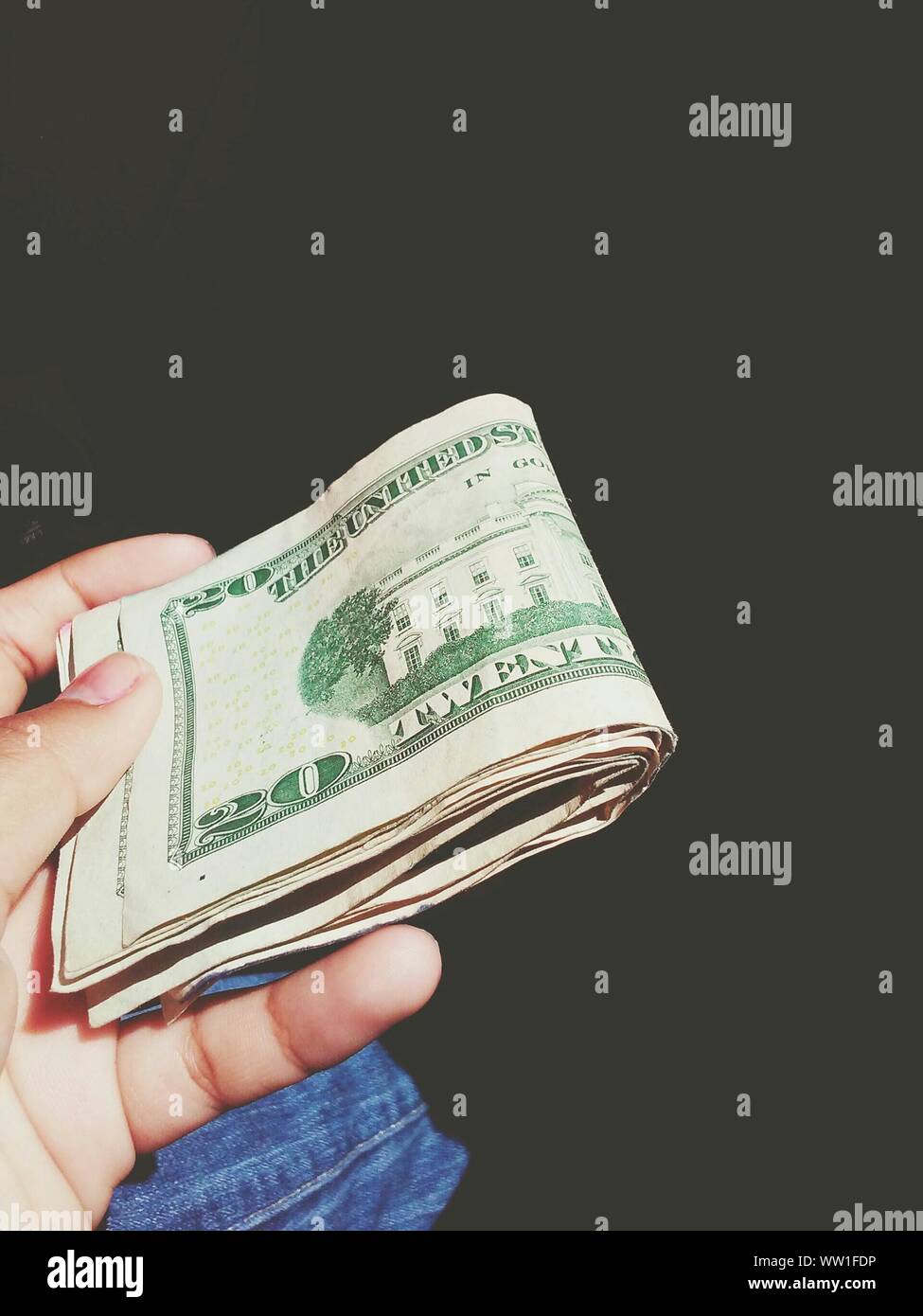 Hand holding 20 dollar bills hi-res stock photography and images - Alamy