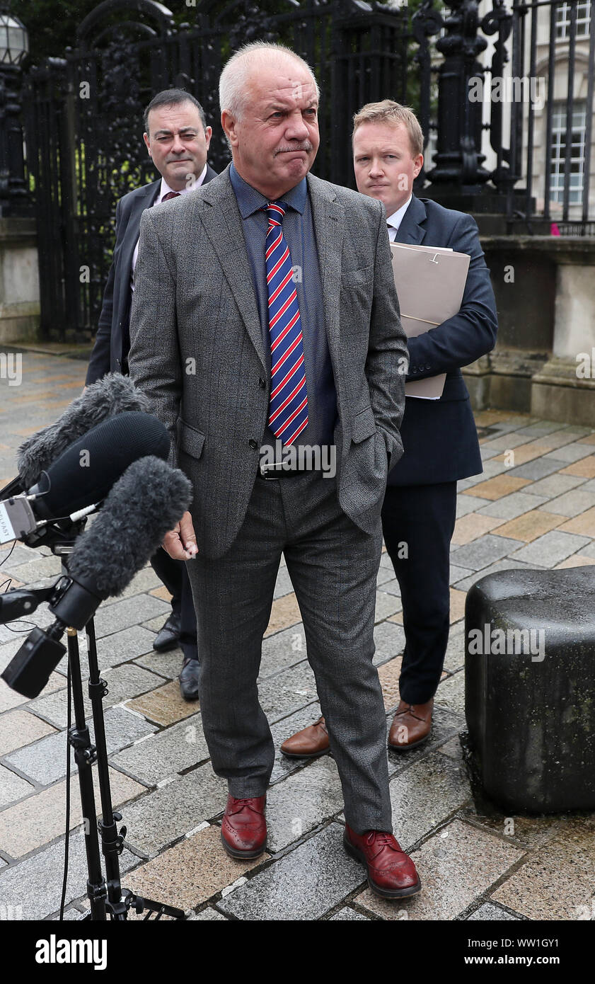 Victims campaigner Raymond McCord (centre) and solicitors Ciaran O'Hare (right) and Paul Farrell ...