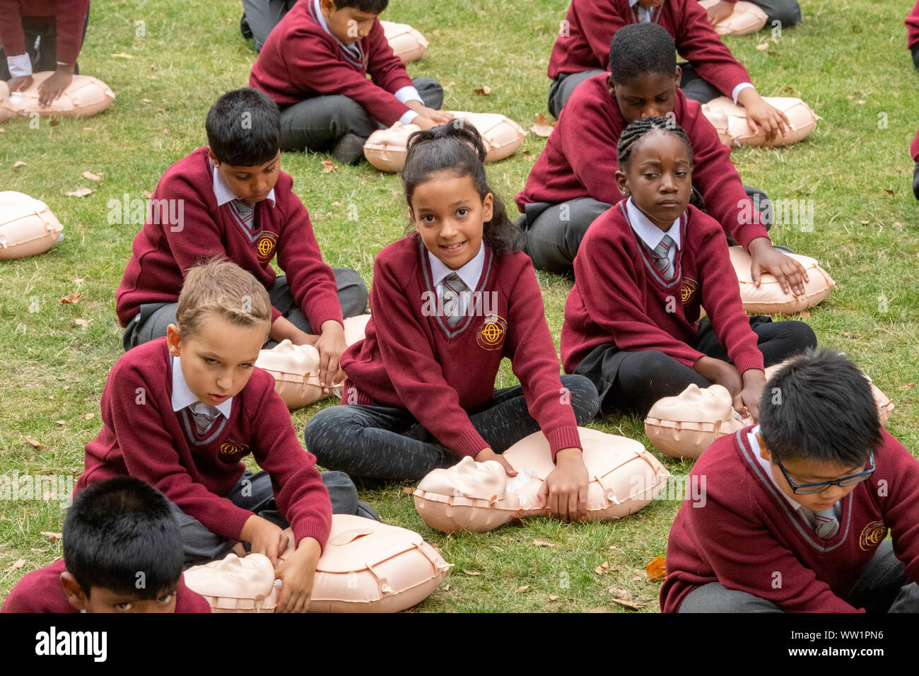 School children with resuscitation dolls hi-res stock photography and ...