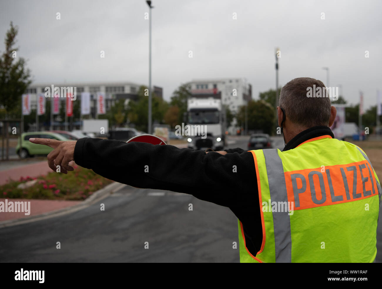 Berlin, Germany. 12th Sep, 2019. A police officer waves a truck that ...