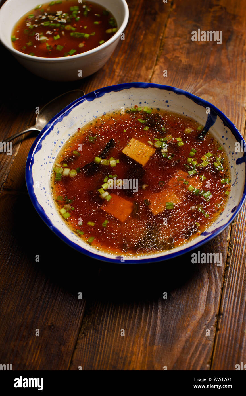 Japanese miso soup with tofu, wakame seaweed, spring onions and pepper flakes Stock Photo - Alamy