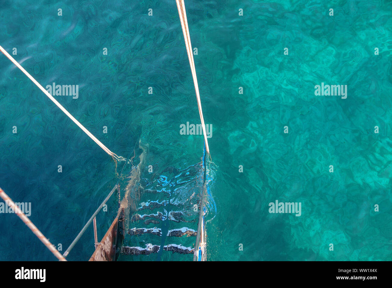 ship ladder in transparent sea water Stock Photo - Alamy
