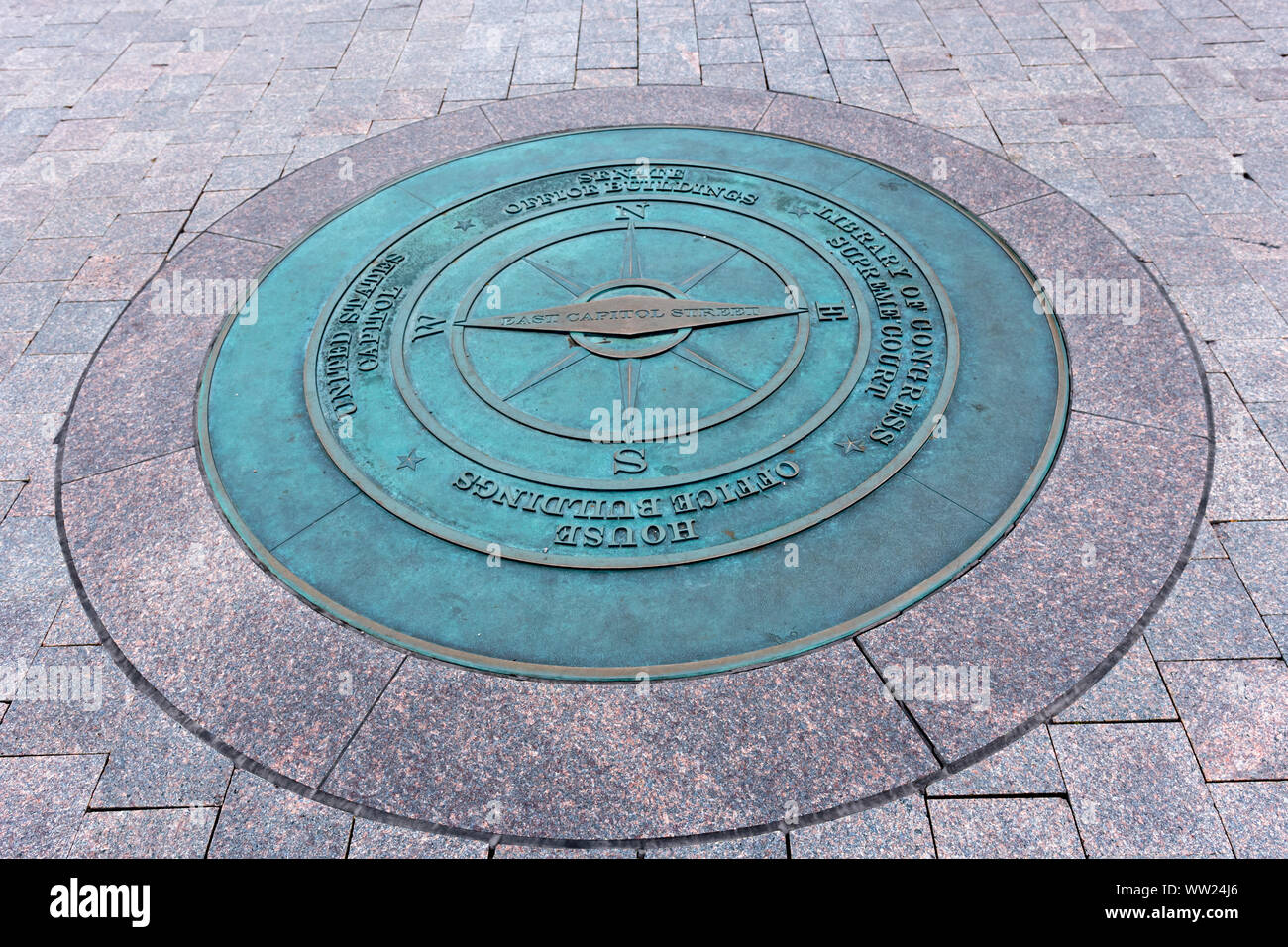 A compass lists the directions to nearby landmarks on Capitol Hill in ...