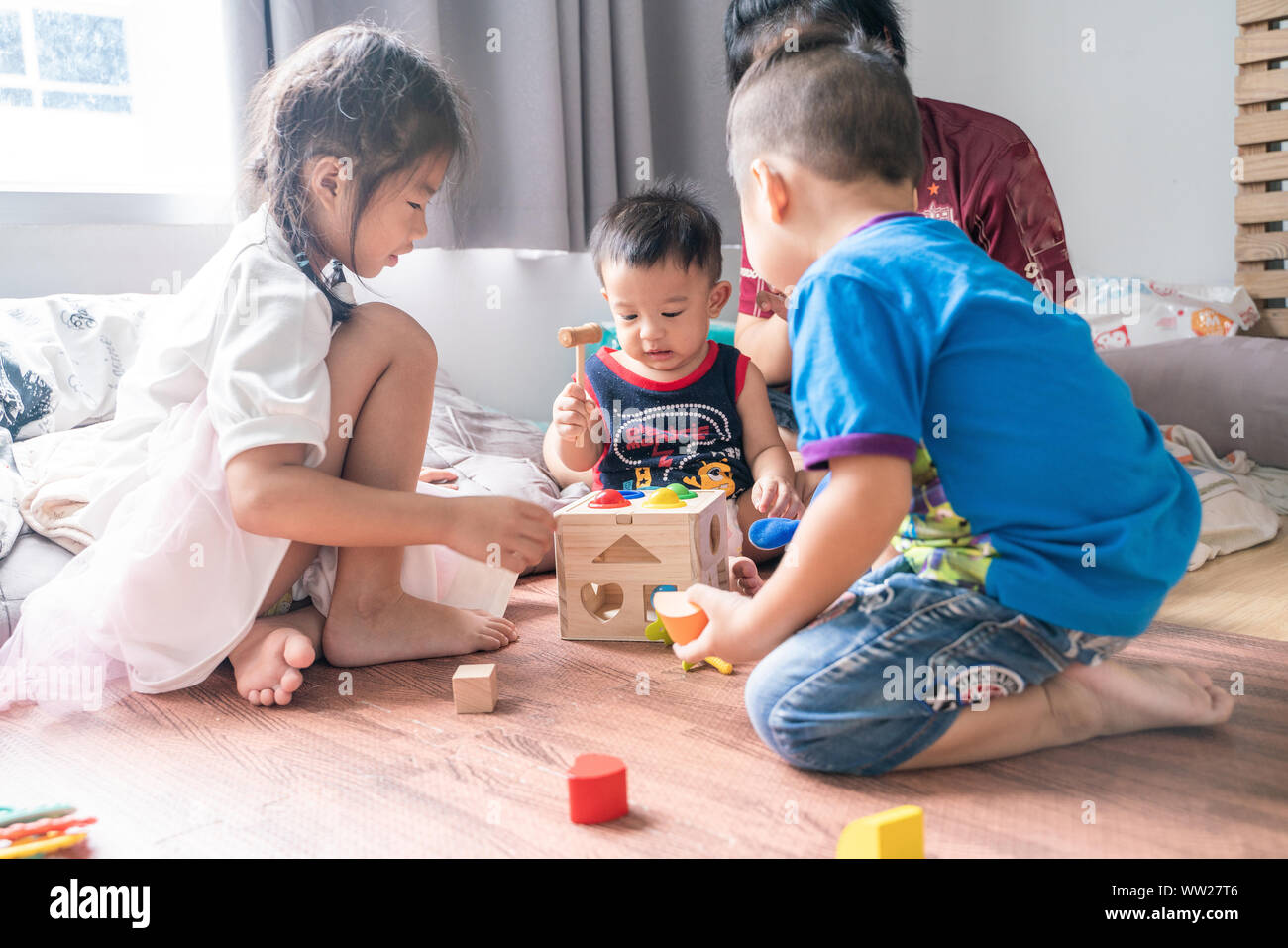 Group of lottle kid friend playing toy together in cozy room Stock ...