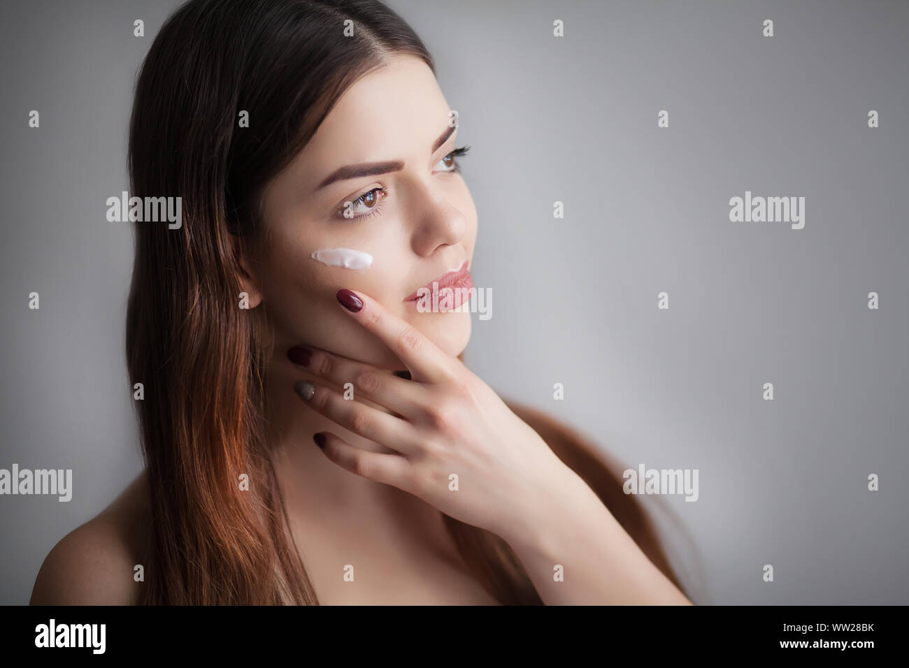 Portrait of beautiful smiling Asian woman with elegant hairstyle and ...