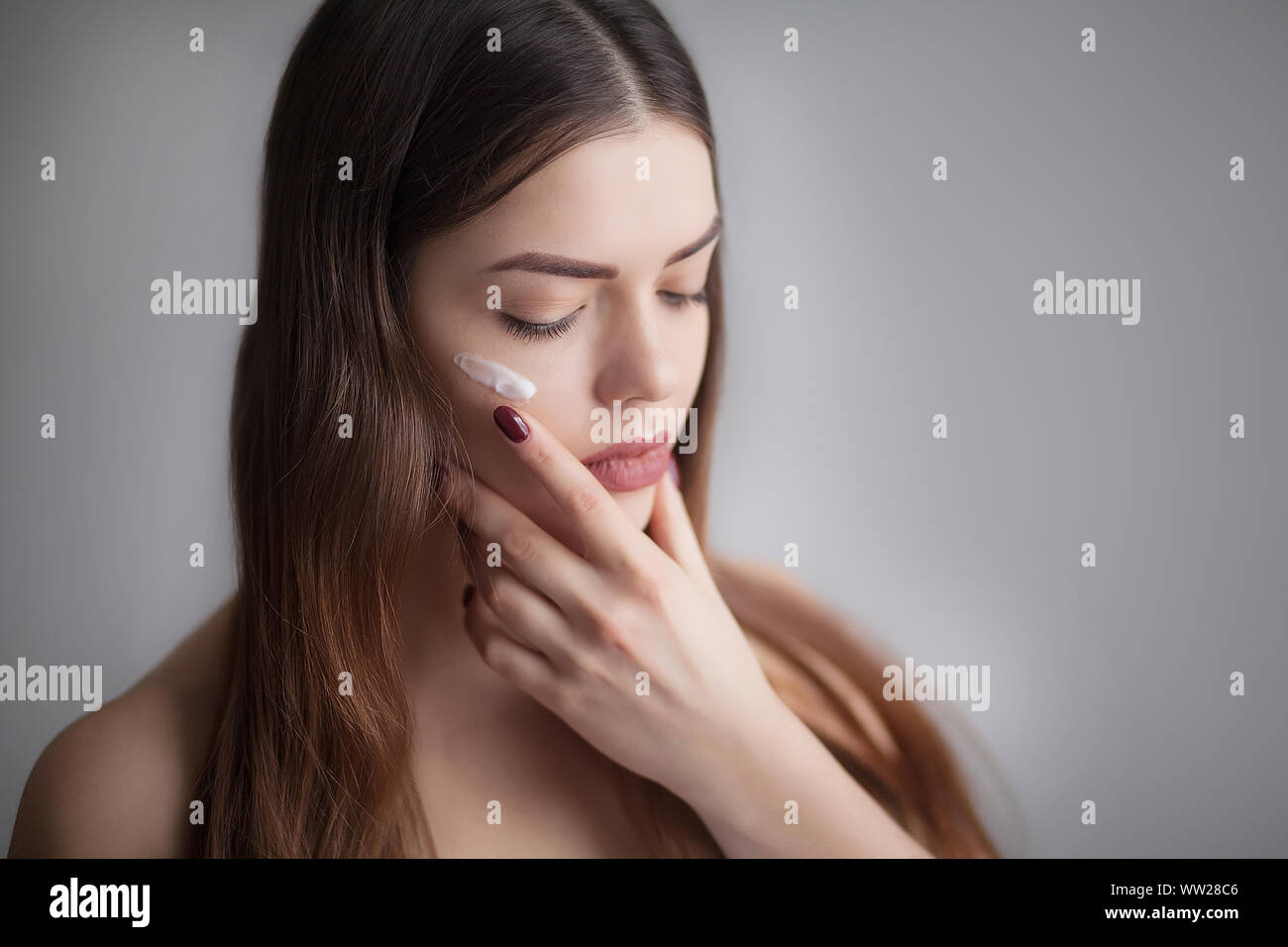 Portrait of beautiful smiling Asian woman with elegant hairstyle and ...