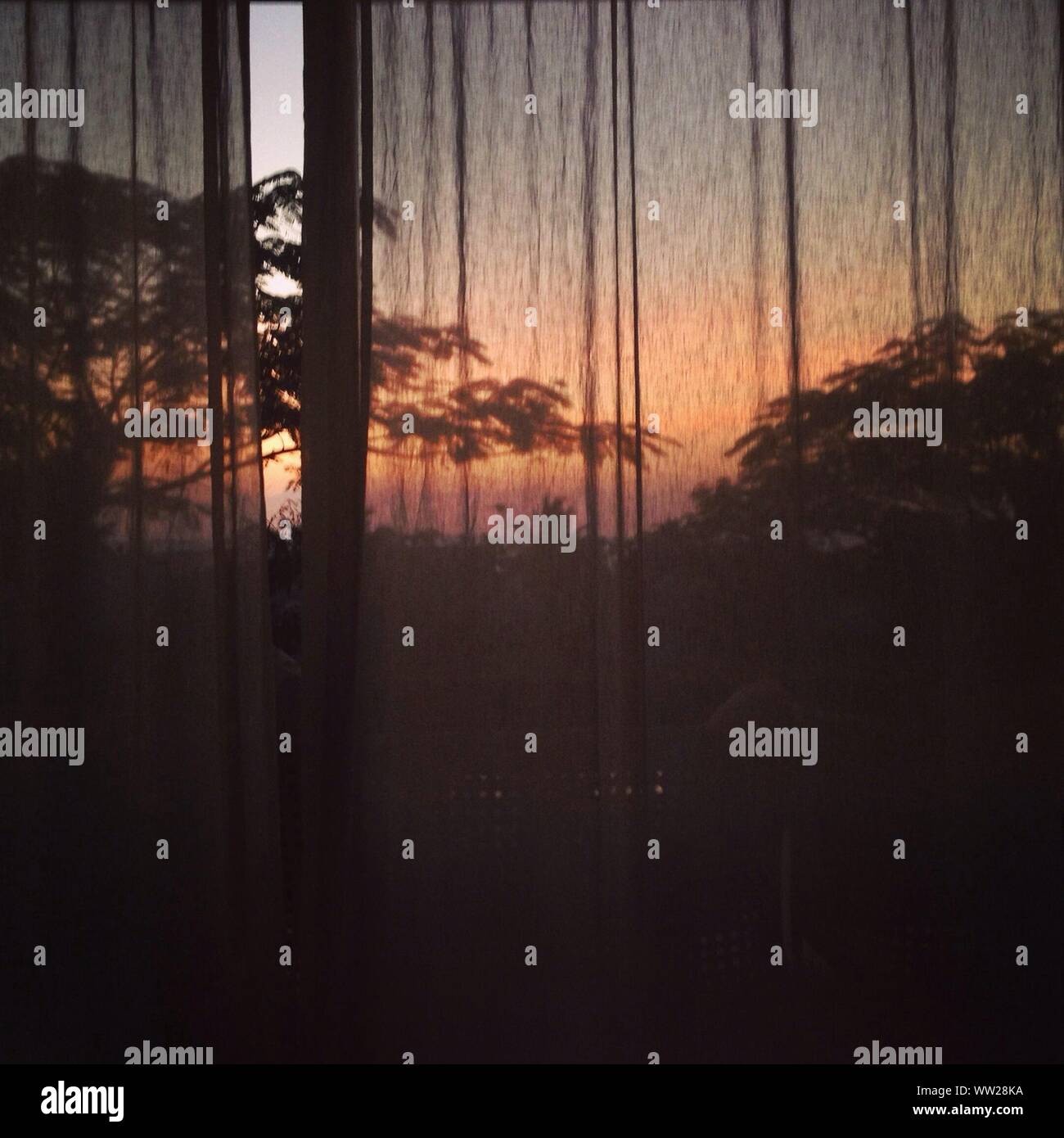 Sunset through curtains hi-res stock photography and images - Alamy