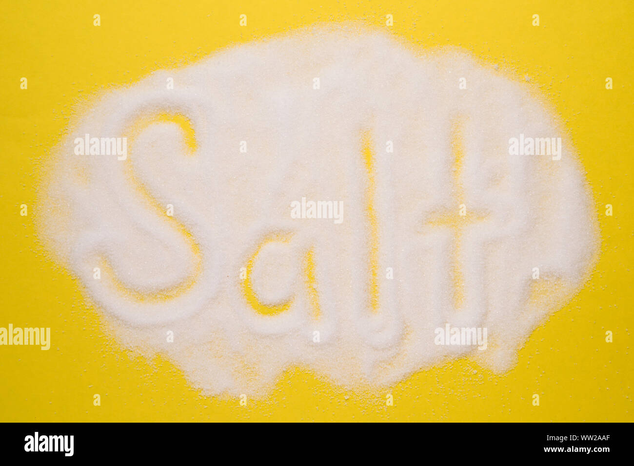 salt word on yellow background. Concept of food ingrediennt, cooking ...