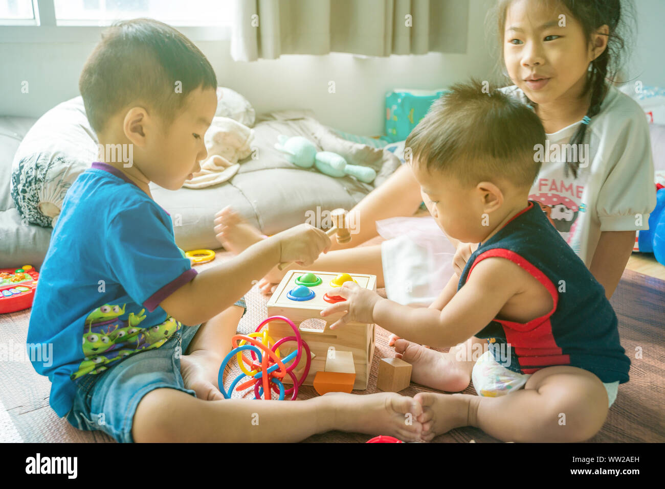 Group of lottle kid friend playing toy together in cozy room Stock ...