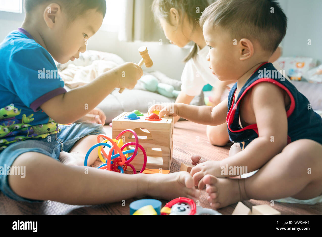 Twins playing with blocks hi-res stock photography and images - Alamy