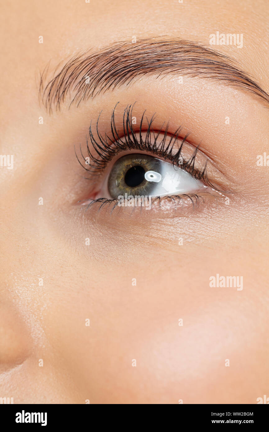 Close up shot of young woman on yellow studio background. Beautiful ...