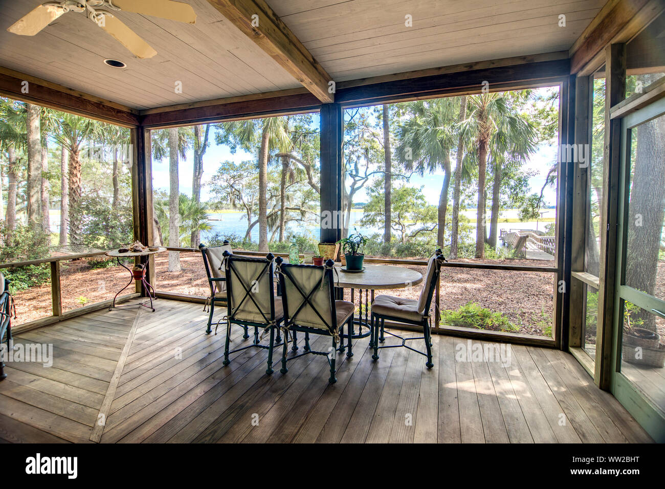 rustic screen porch with forest and waterfront view Stock Photo - Alamy